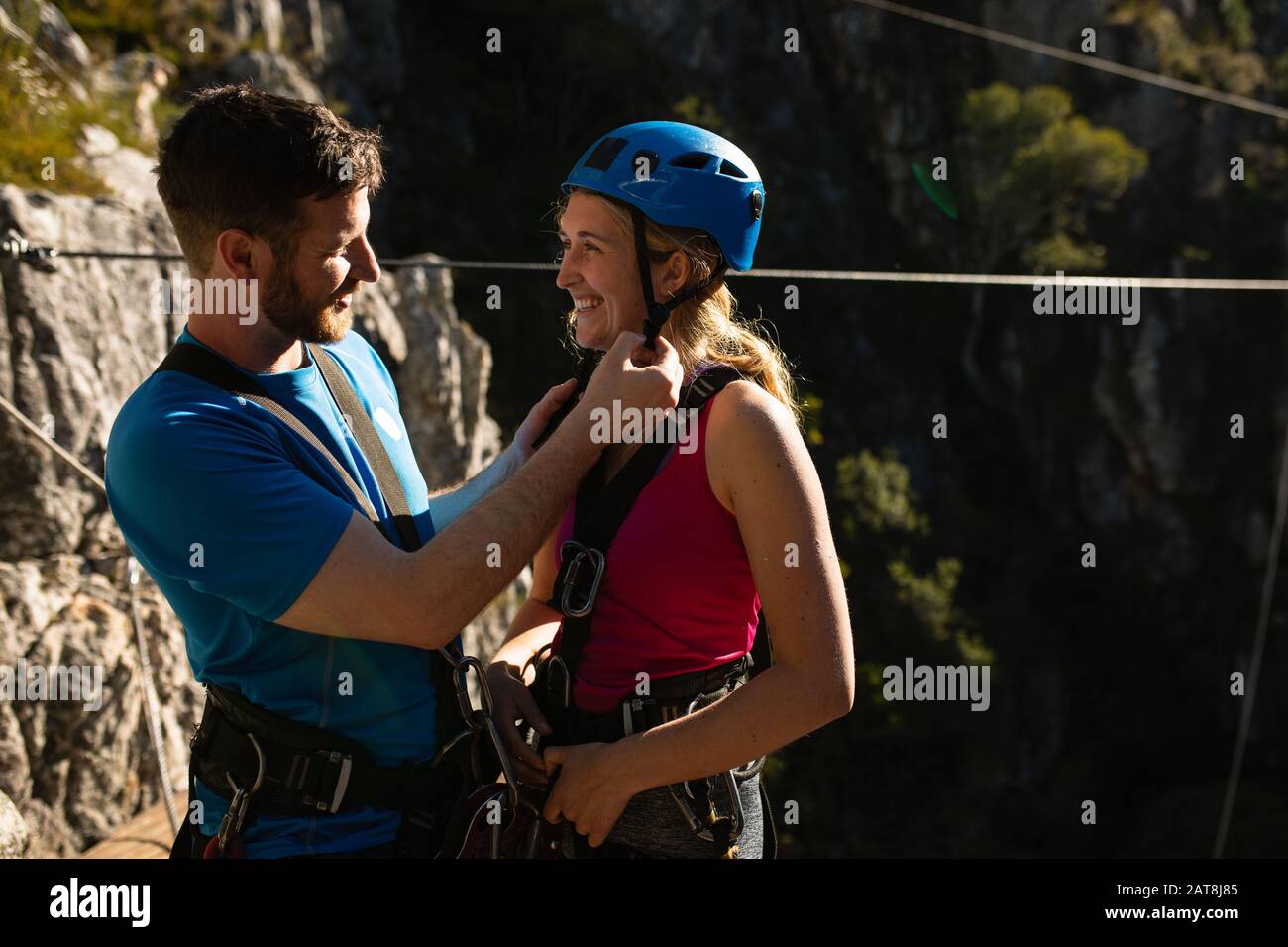 Couple ready to do zip line Stock Photo - Alamy