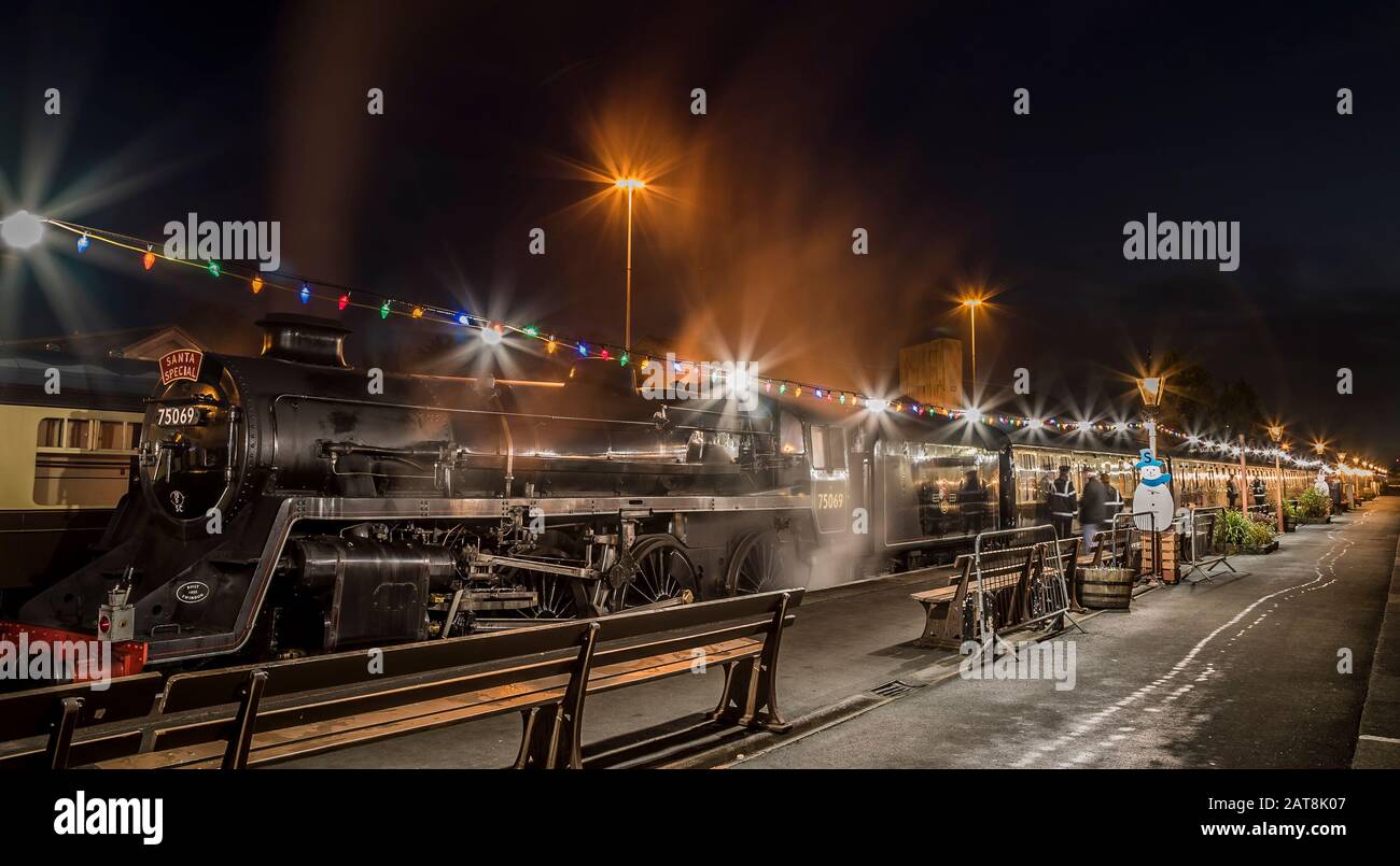 Side view close up of vintage UK steam train Christmas Santa Special ...