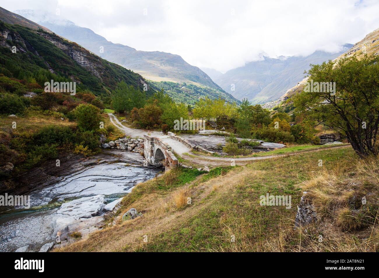 Old stone bridge in the Alps mountains. FRance Stock Photo - Alamy