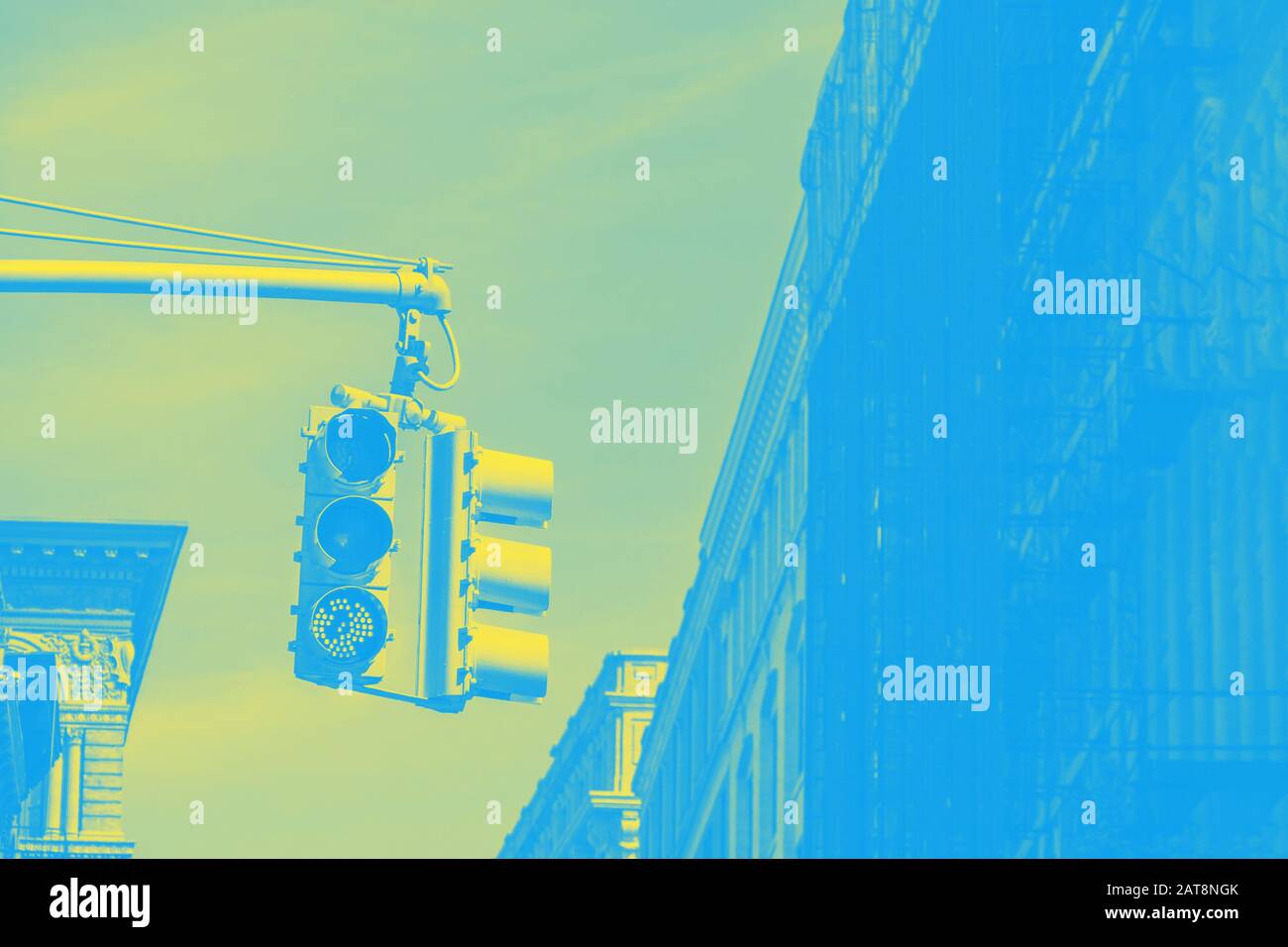 American traffic light and skyscrapers, fragment. Blue and yellow toned ...