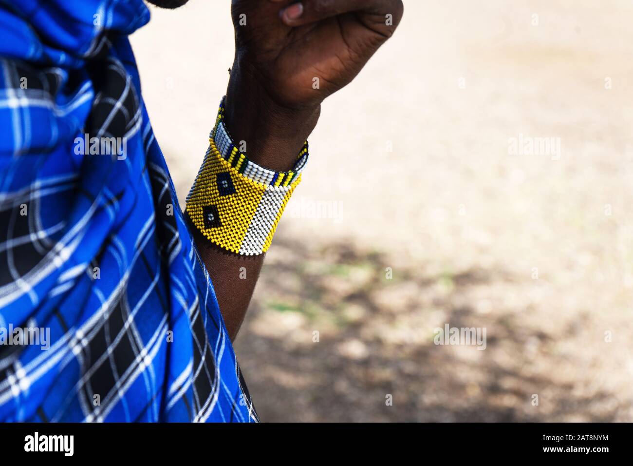 Tribal masai hand with a colorful bracelet and classic blue color ...