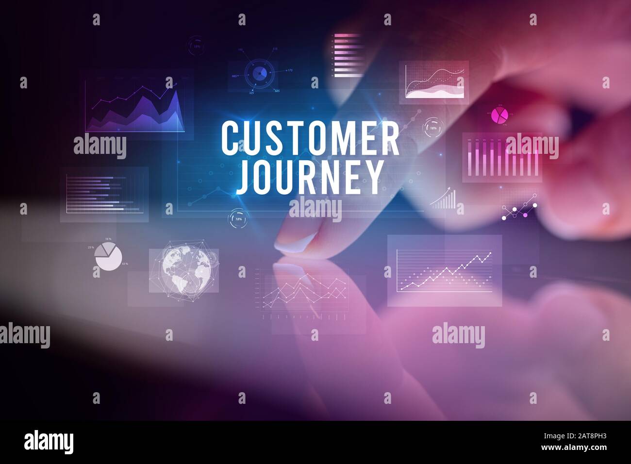 Finger touching tablet with charts and CUSTOMER JOURNEY inscription ...