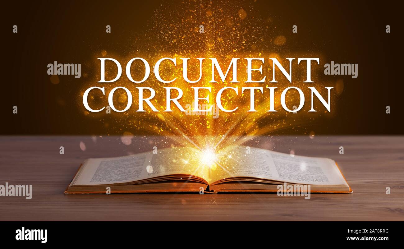 DOCUMENT CORRECTION inscription coming out from an open book ...