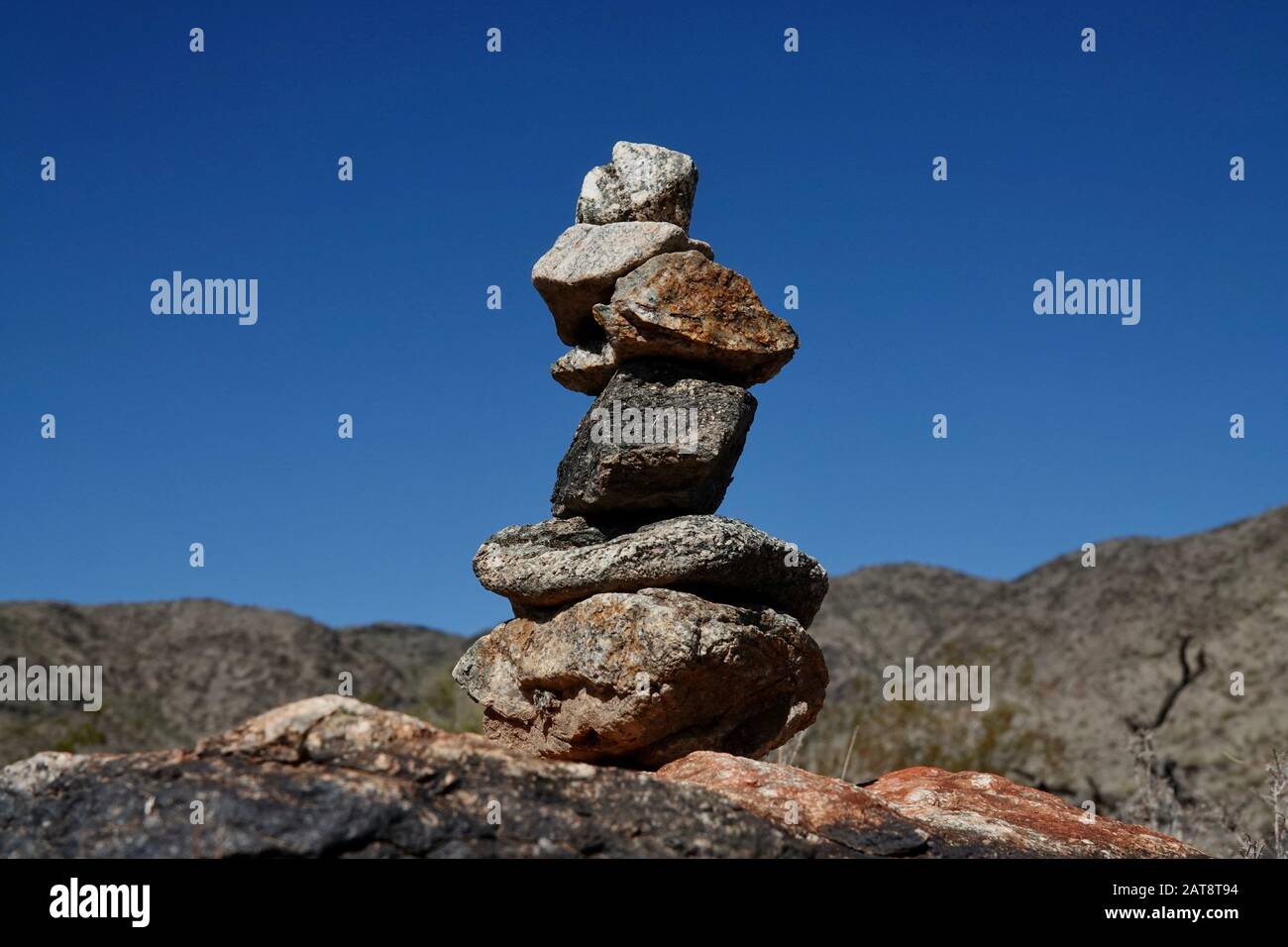 A stack of rocks known as a cairn marks the path for hikers Stock Photo ...