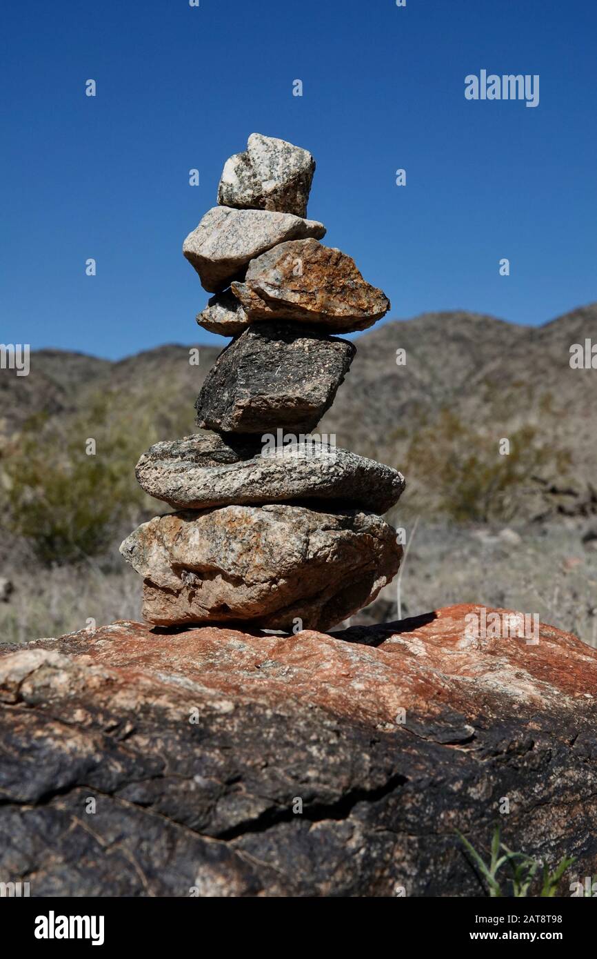 A stack of rocks known as a cairn marks the path for hikers Stock Photo ...
