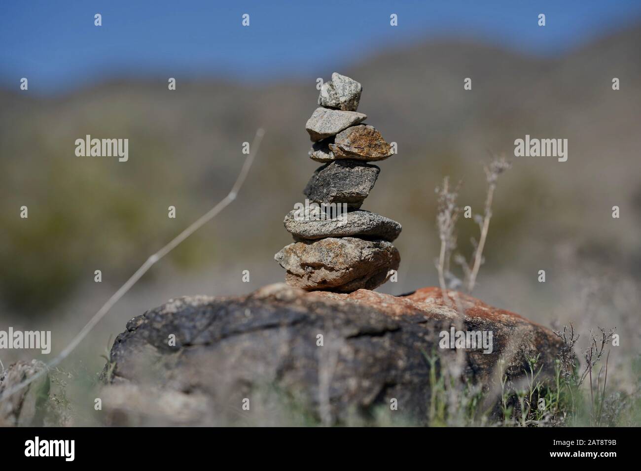 A stack of rocks known as a cairn marks the path for hikers Stock Photo ...