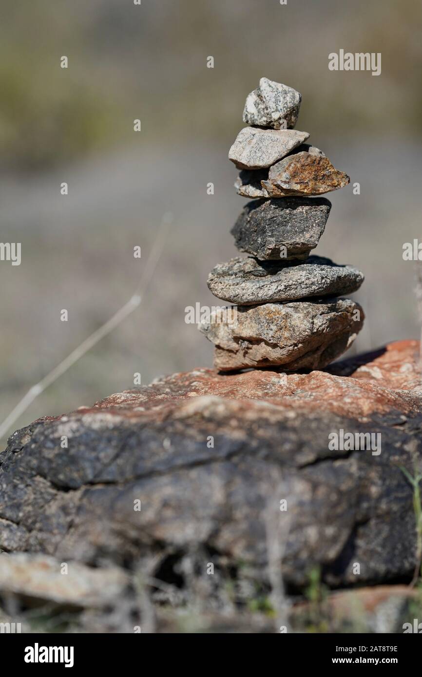 A stack of rocks known as a cairn marks the path for hikers Stock Photo ...