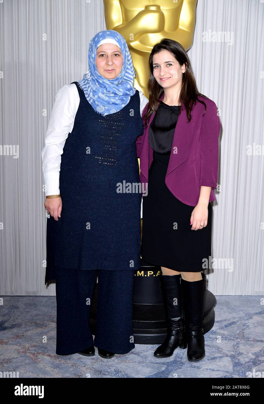 Waad al-Kateab (right) and guest attending the Academy Award Nominees ...