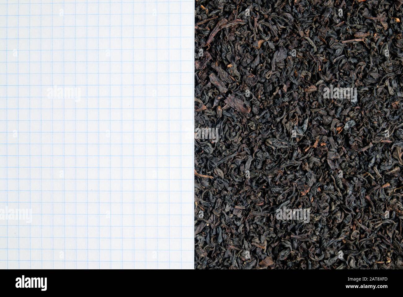 Clean sheet in a cage on background of black tea with copy space ...