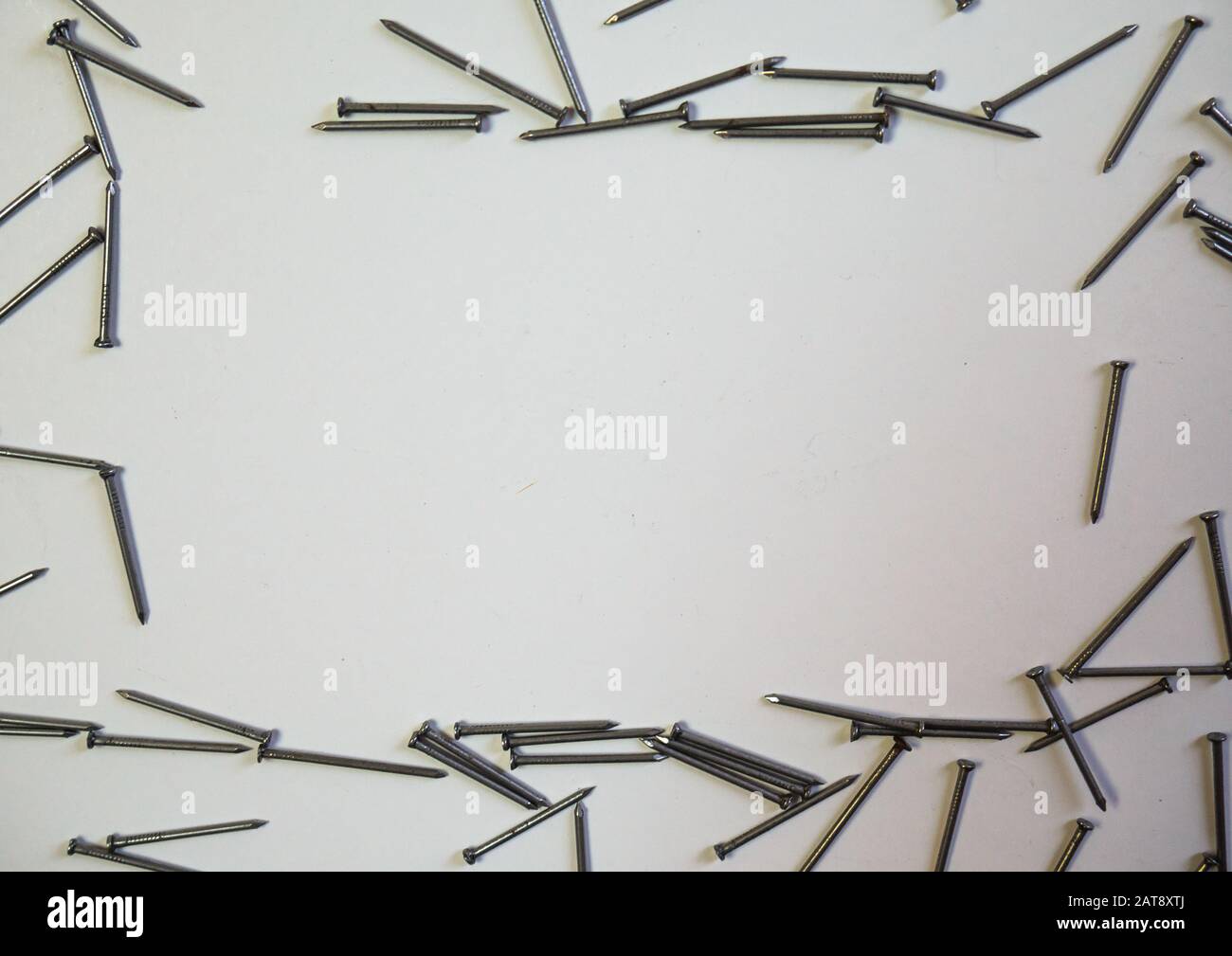 Flat lay nails on a white background. Copy space Stock Photo - Alamy