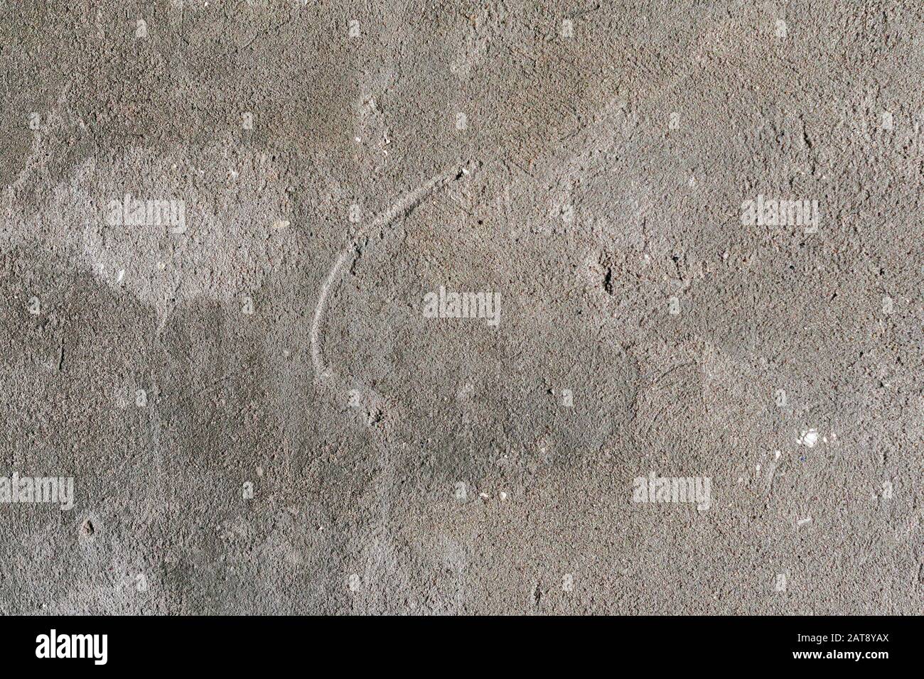 Asphalt close-up, wet concrete texture of the wall. Raw plaster wall ...