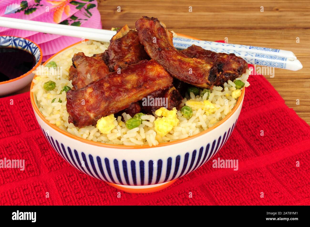 Chinese style mini pork ribs with egg fried rice Stock Photo - Alamy
