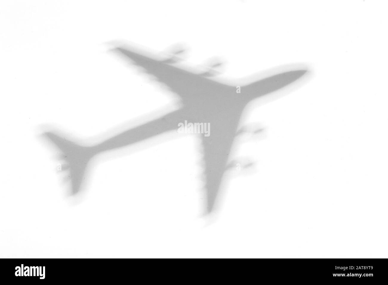 Shadow of an airplane on a white background Stock Photo - Alamy