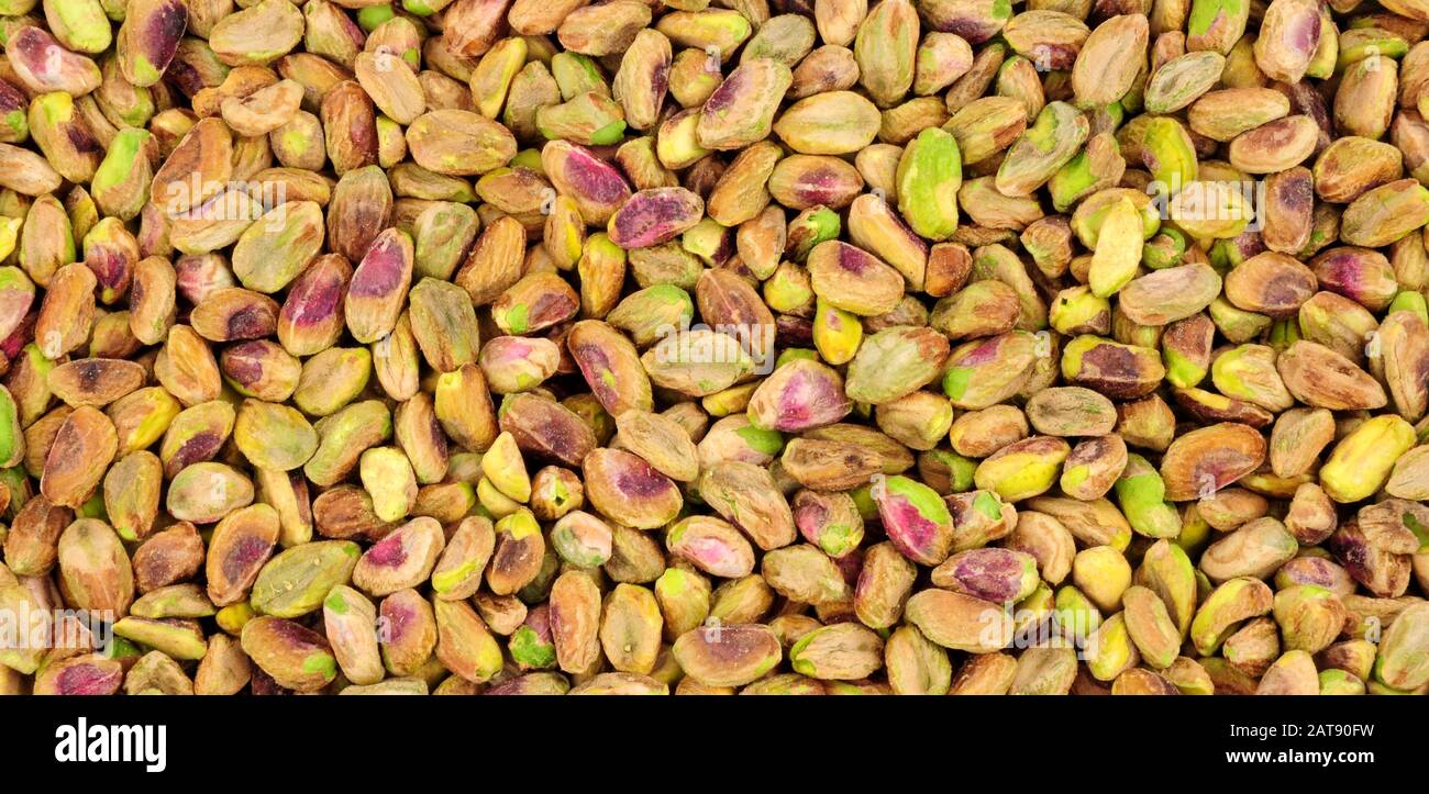 fresh raw shelled pistachio nut kernel background Stock Photo - Alamy
