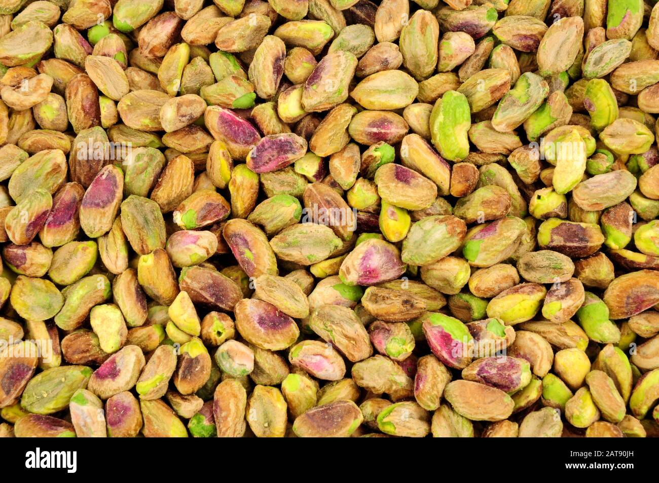 fresh raw shelled pistachio nut kernel background Stock Photo - Alamy