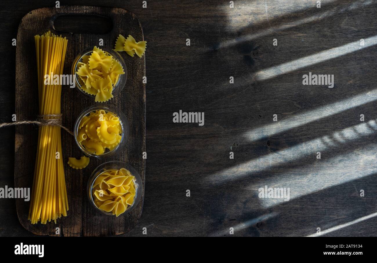 Cooking concept with different varieties of italian pasta on rustic ...