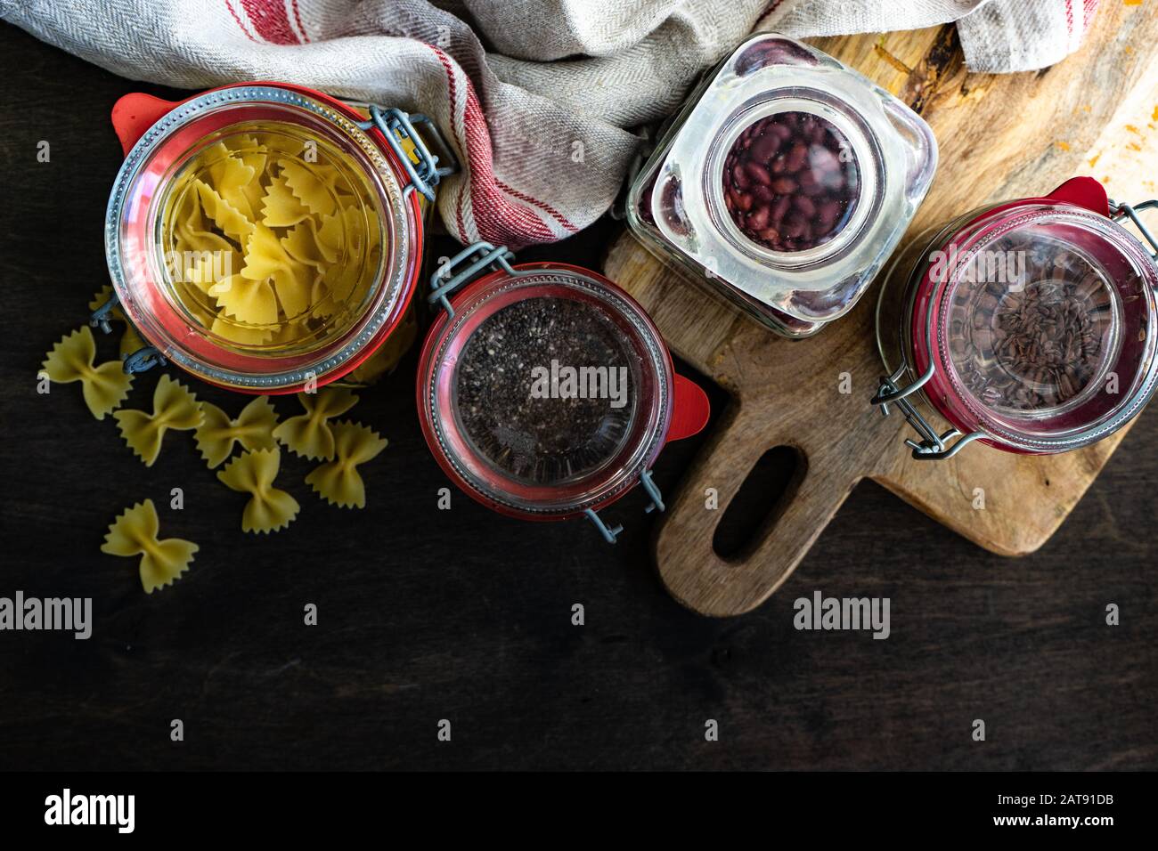 Cooking food concept with pasta, seeds and beans on wooden background ...