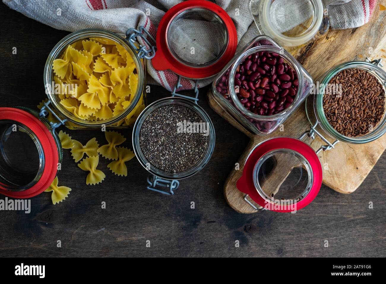 Cooking food concept with pasta, seeds and beans on wooden background ...