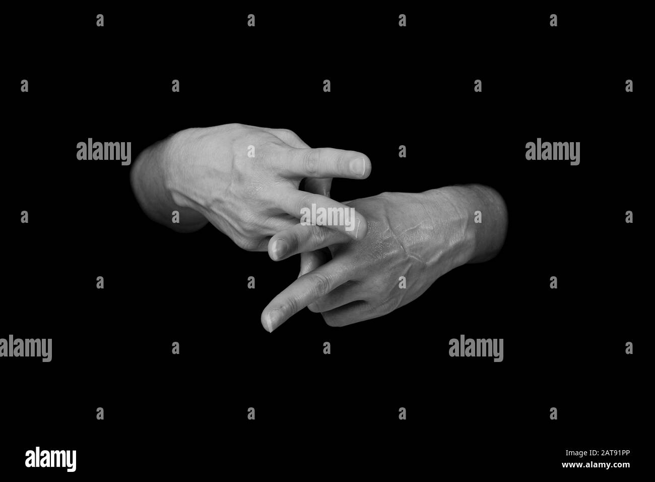 The word CARE in British sign language on an isolated black background ...