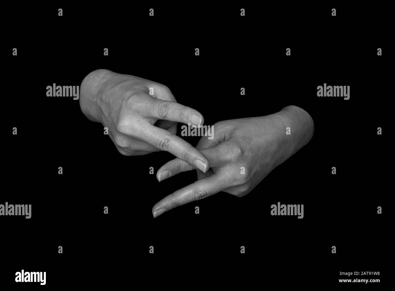 The word CARE in British sign language on an isolated black background ...