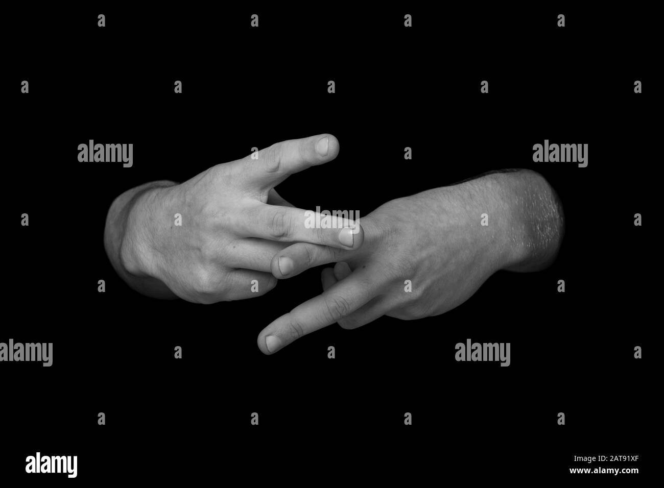 The word CARE in British sign language on an isolated black background ...