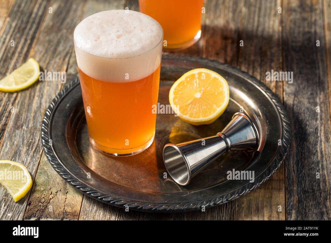 Refreshing Aperol Beer Shandy Cocktail with Lemon Stock Photo - Alamy