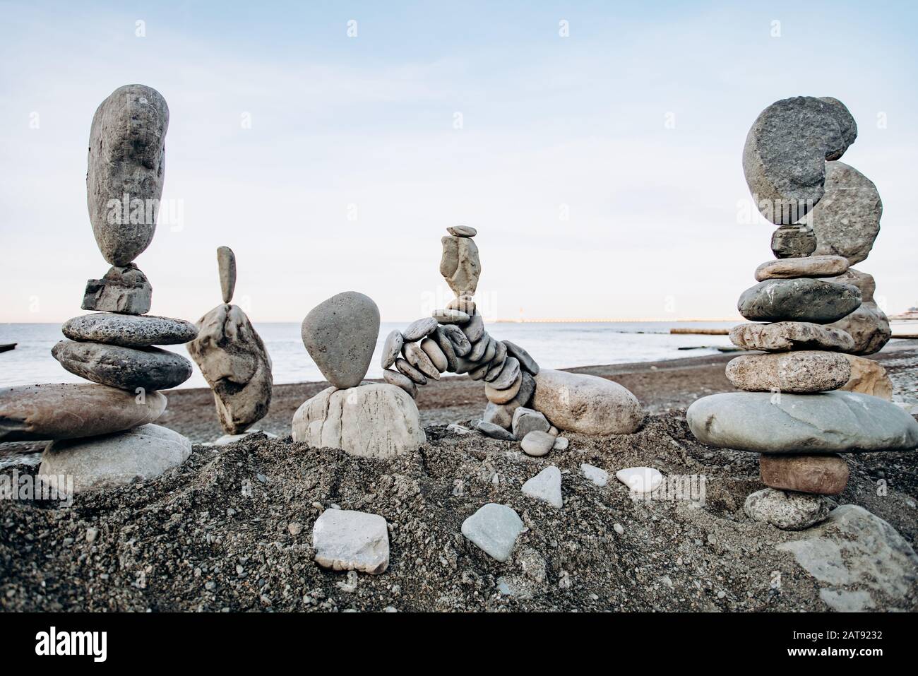 Figures of stones on the beach near the sea. Sea background and stone ...