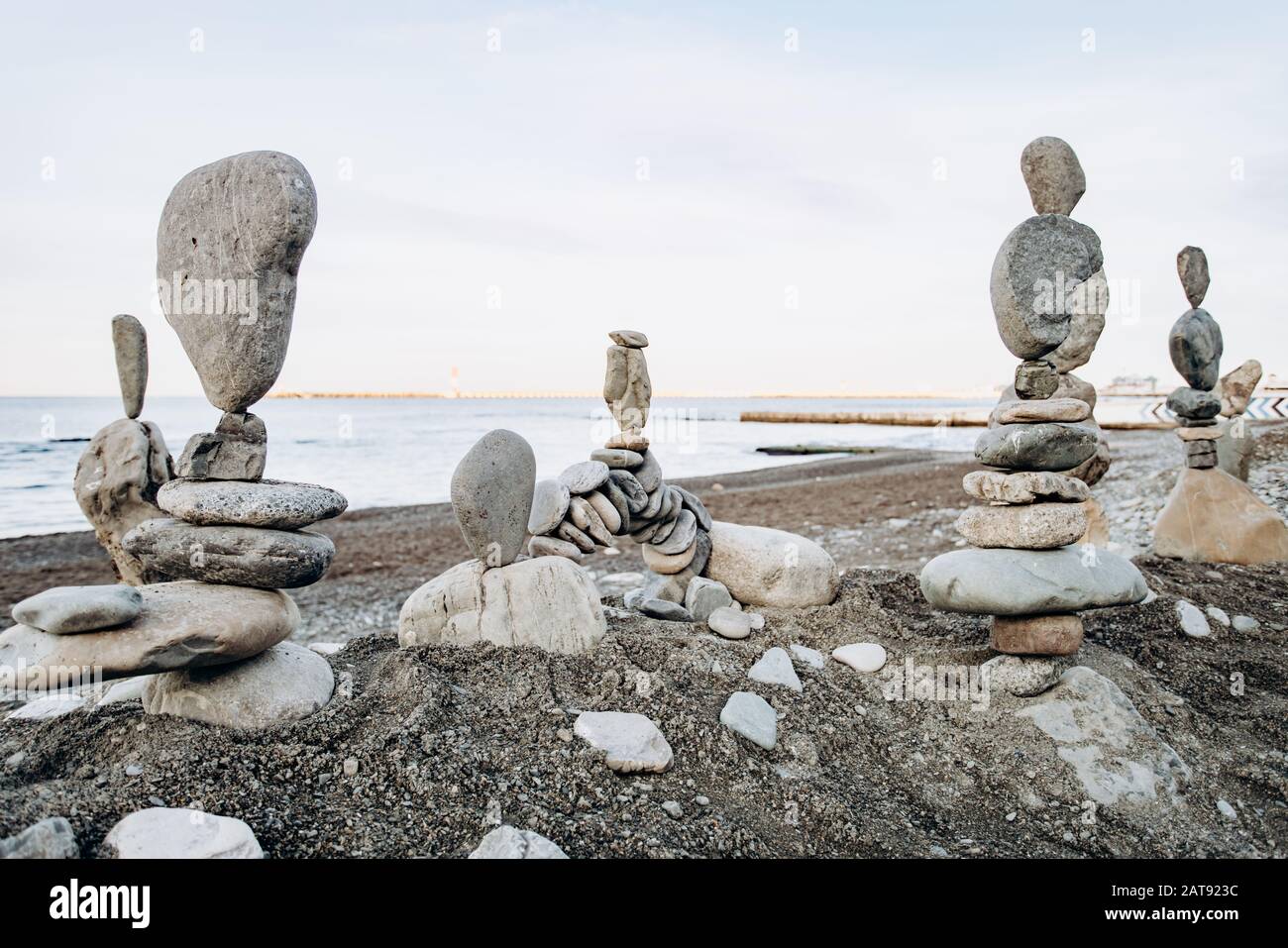 Figures of stones on the beach near the sea. Sea background and stone ...