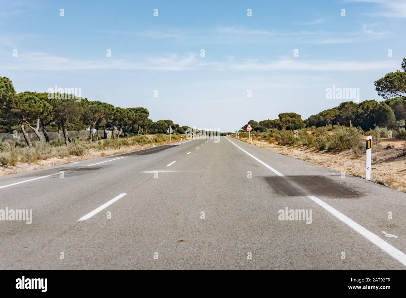 Paved road and beautiful green landscape in summer Stock Photo - Alamy