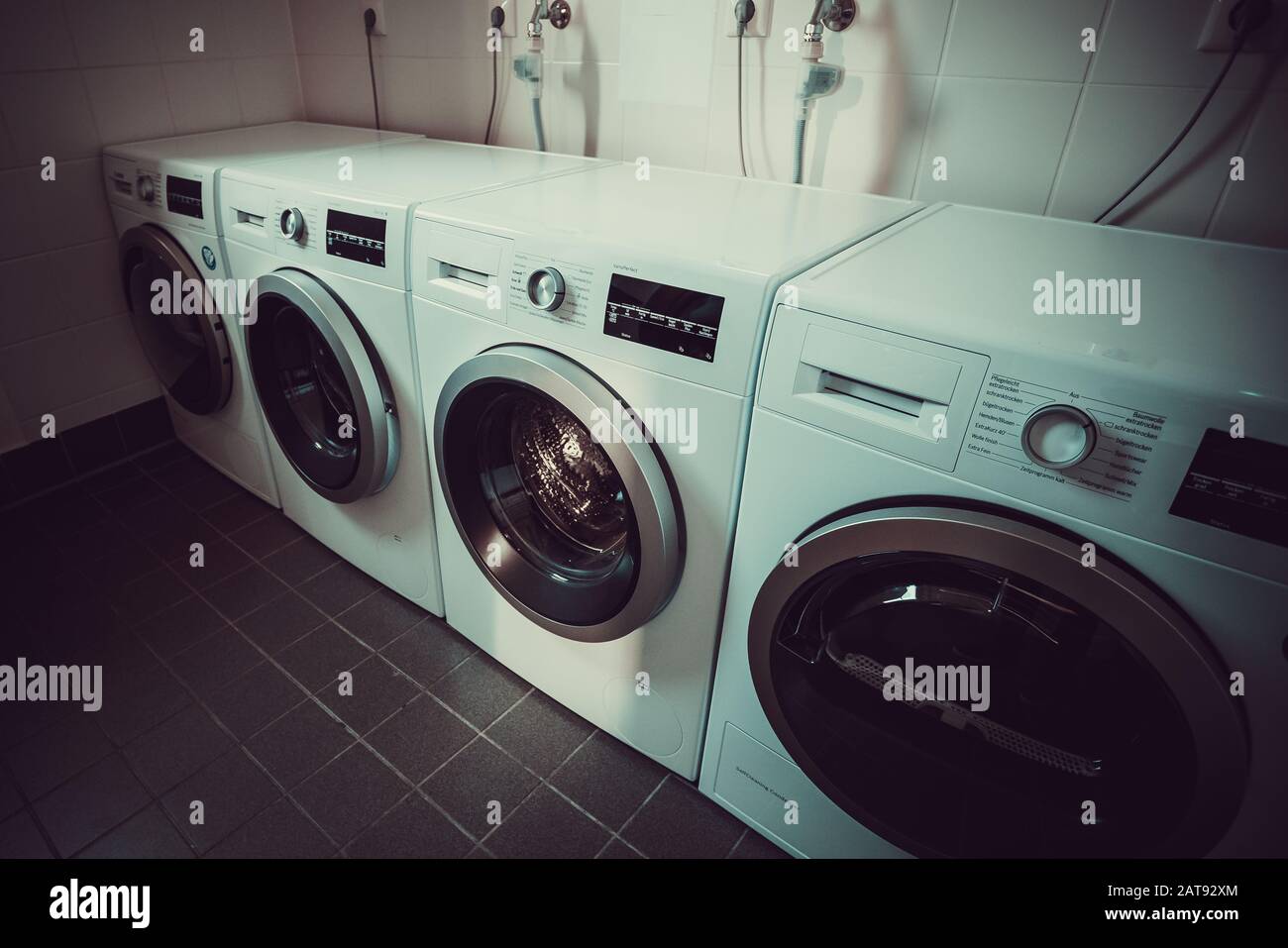 Washing Machines In Launderette. laundry machines Stock Photo - Alamy