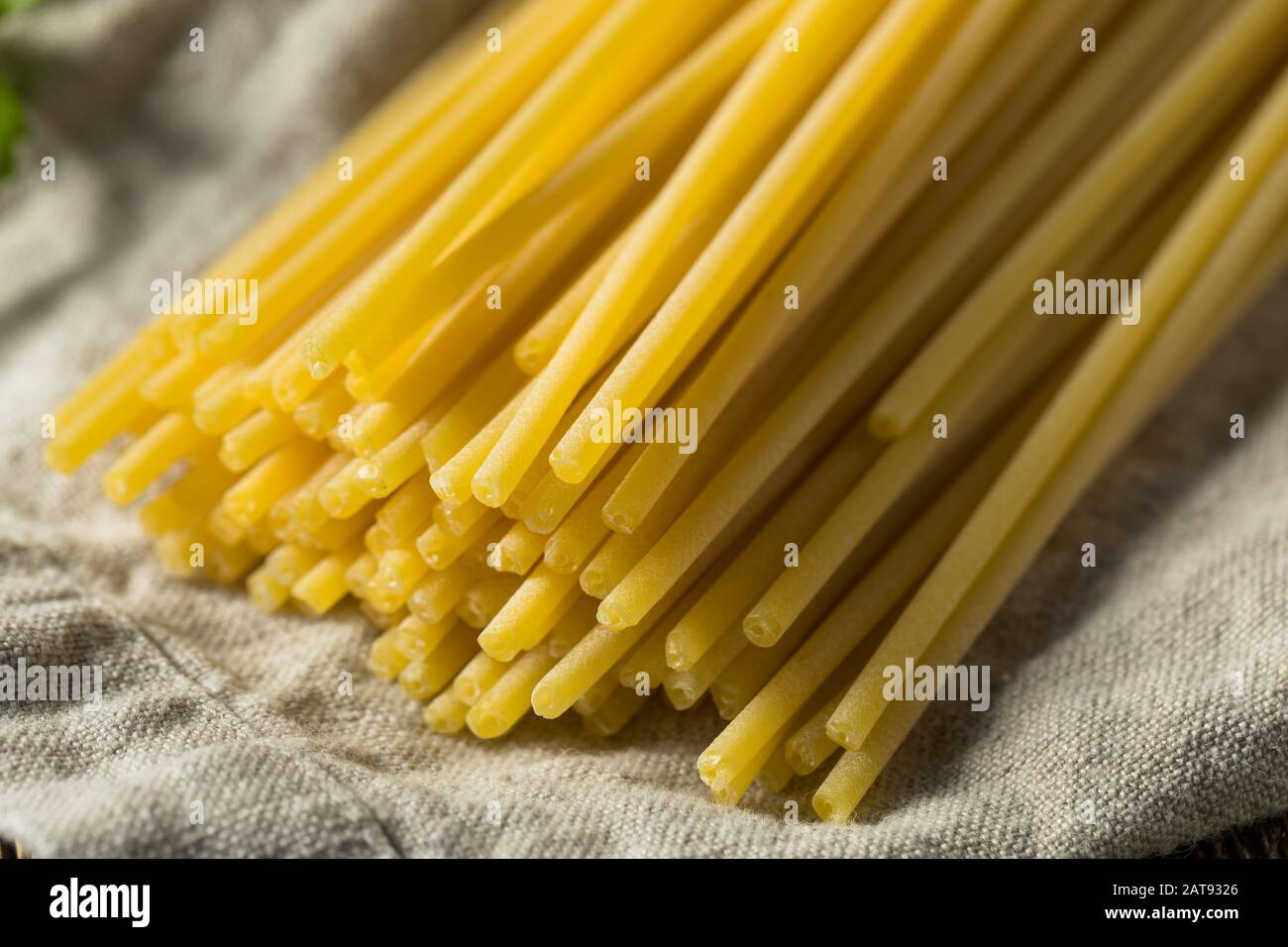 Dry uncooked bucatini pasta hi-res stock photography and images - Alamy