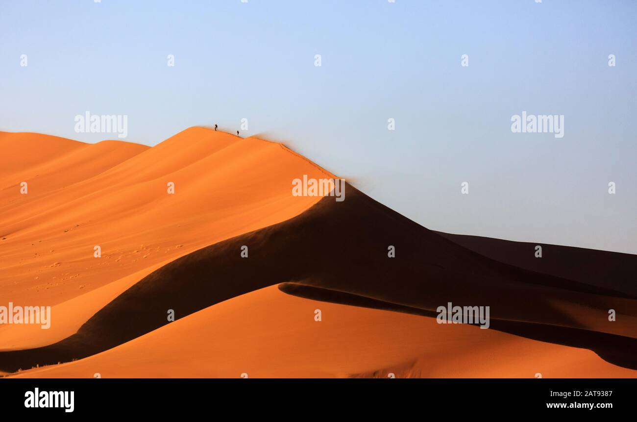 Beautiful landscape with red huge sand dunes at sunset in desert ...