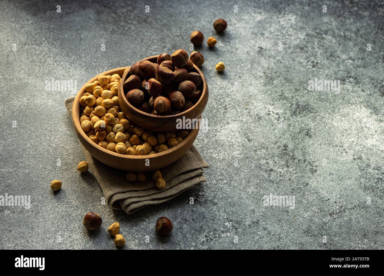 Different types of hazelnuts on dark wooden background with copyspace ...