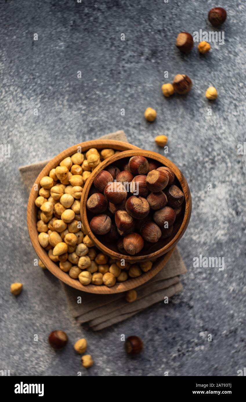 Different types of hazelnuts on dark wooden background with copyspace ...
