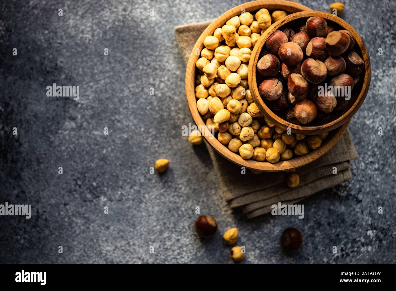 Different types of hazelnuts on dark wooden background with copyspace ...