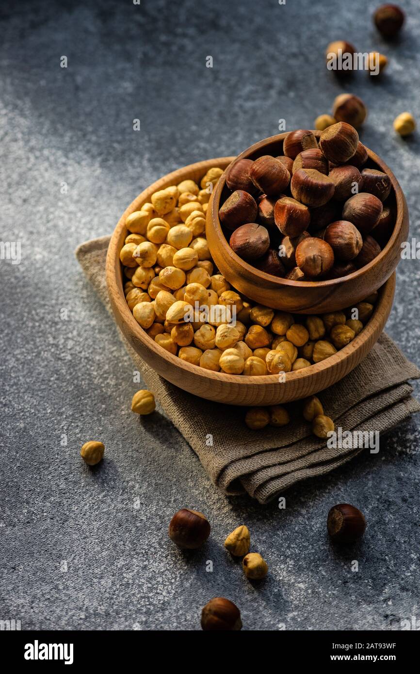 Different types of hazelnuts on dark wooden background with copyspace ...