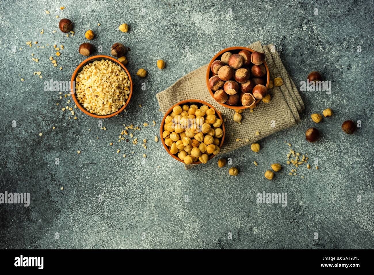 Different types of hazelnuts on dark wooden background with copyspace ...