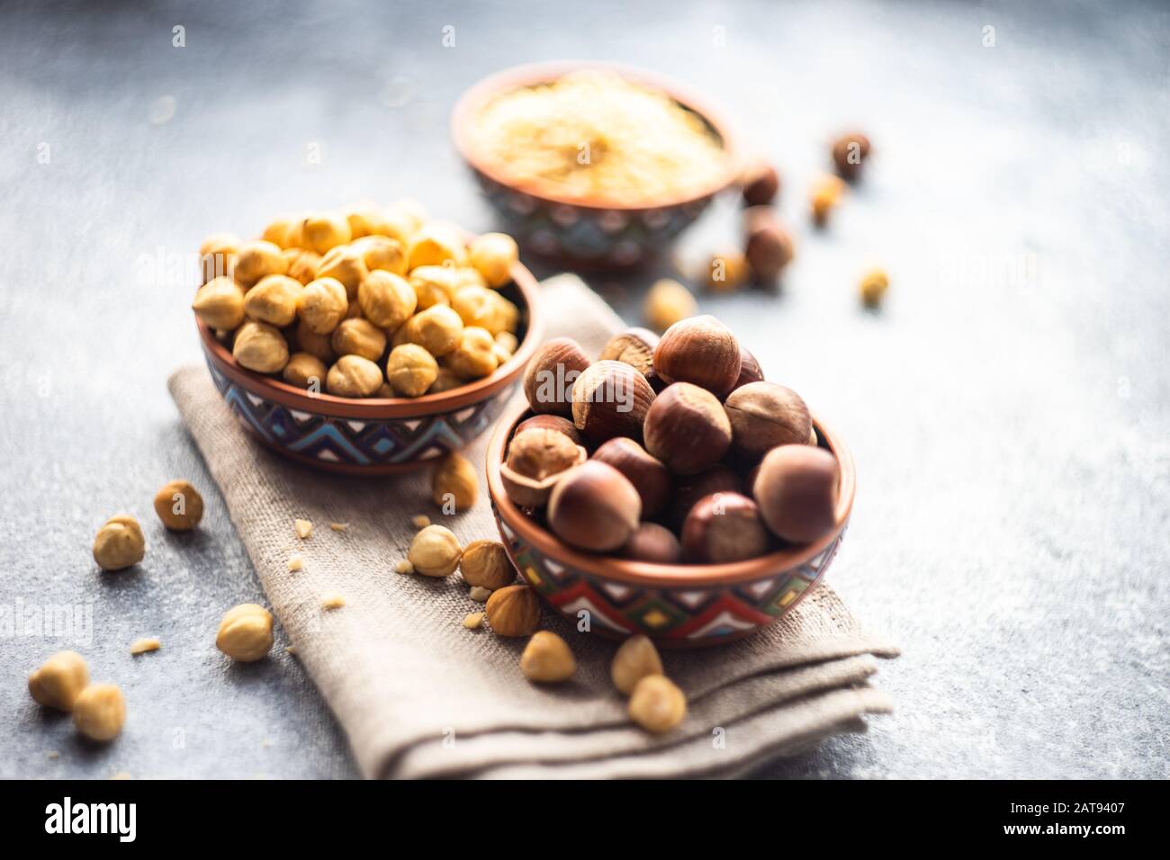 Different types of hazelnuts on dark wooden background with copyspace ...