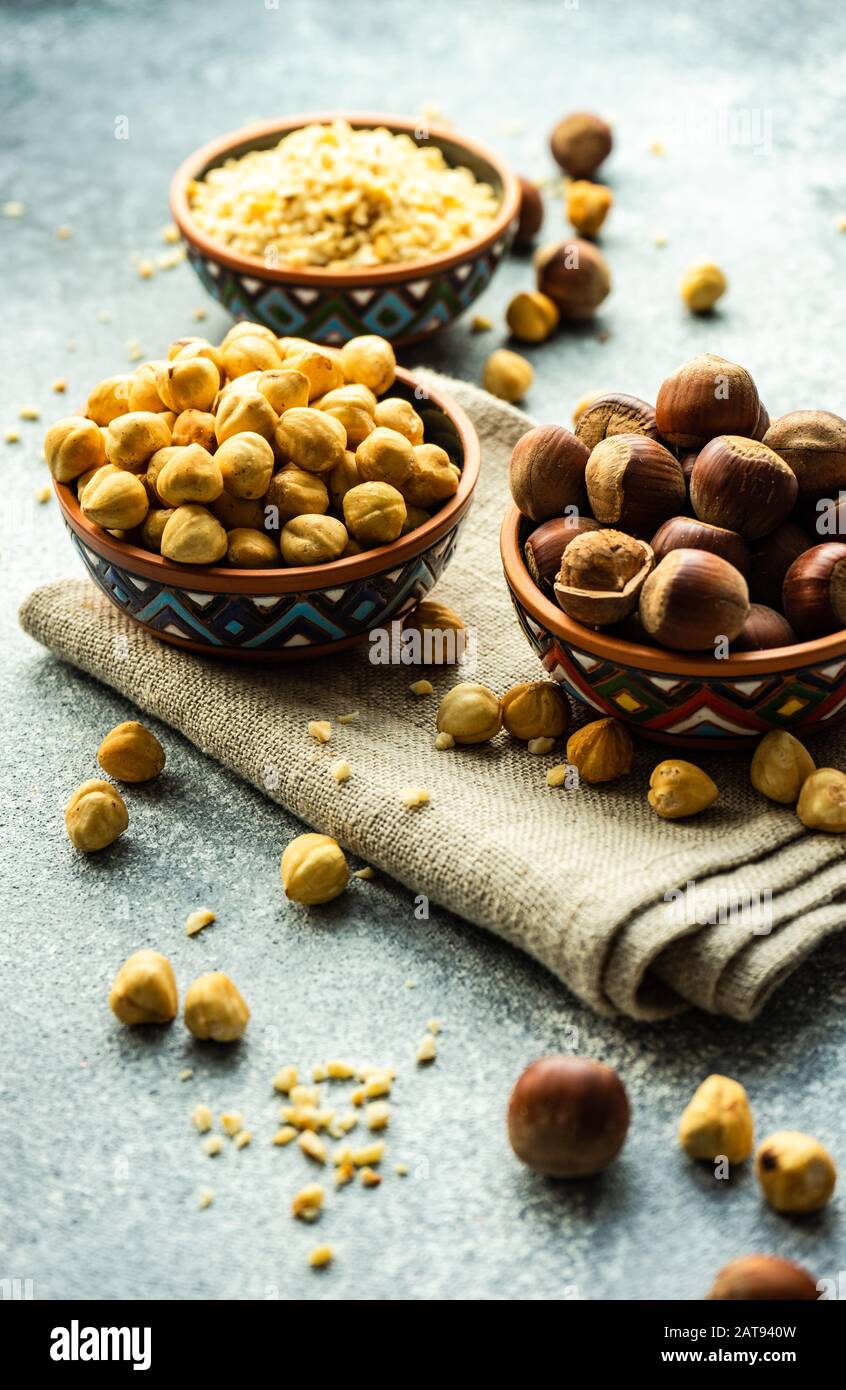 Different types of hazelnuts on dark wooden background with copyspace ...