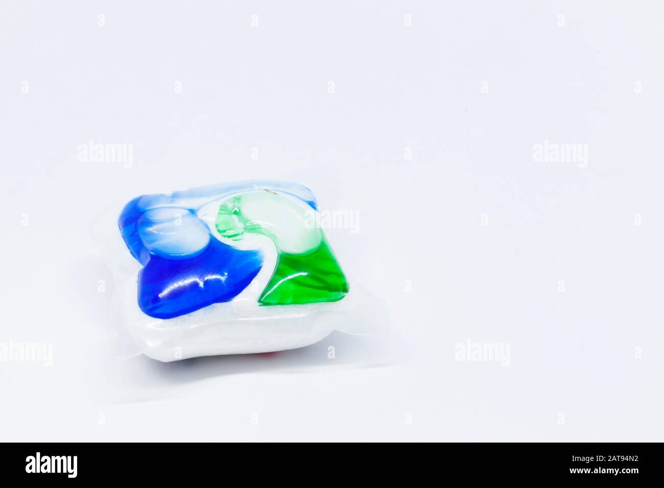 dishwasher tablet on white background Stock Photo - Alamy
