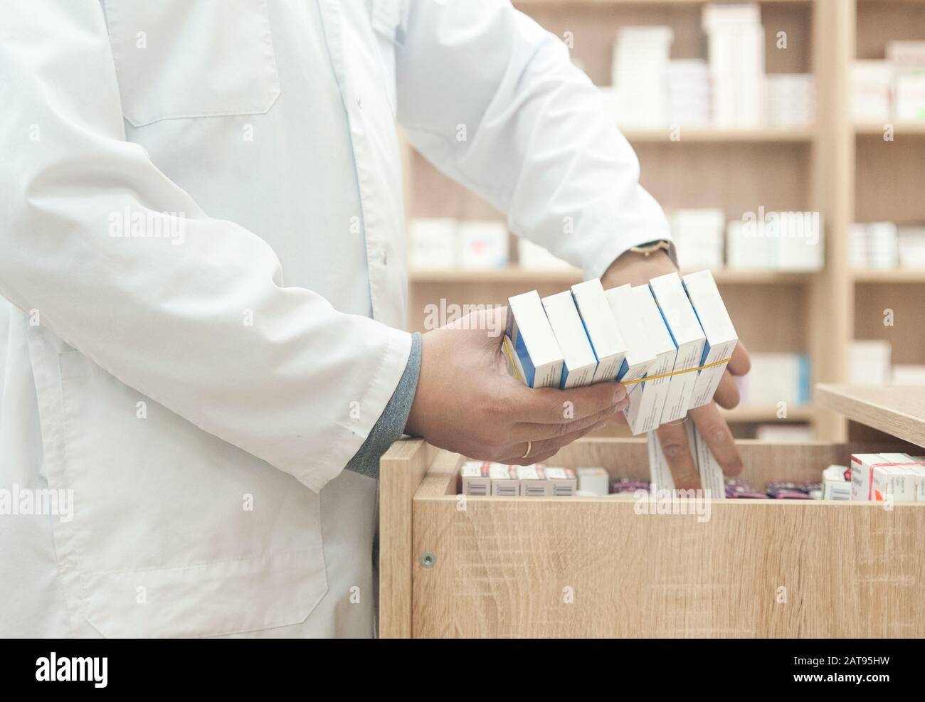 Pharmacist holds pack drugs hi-res stock photography and images - Alamy