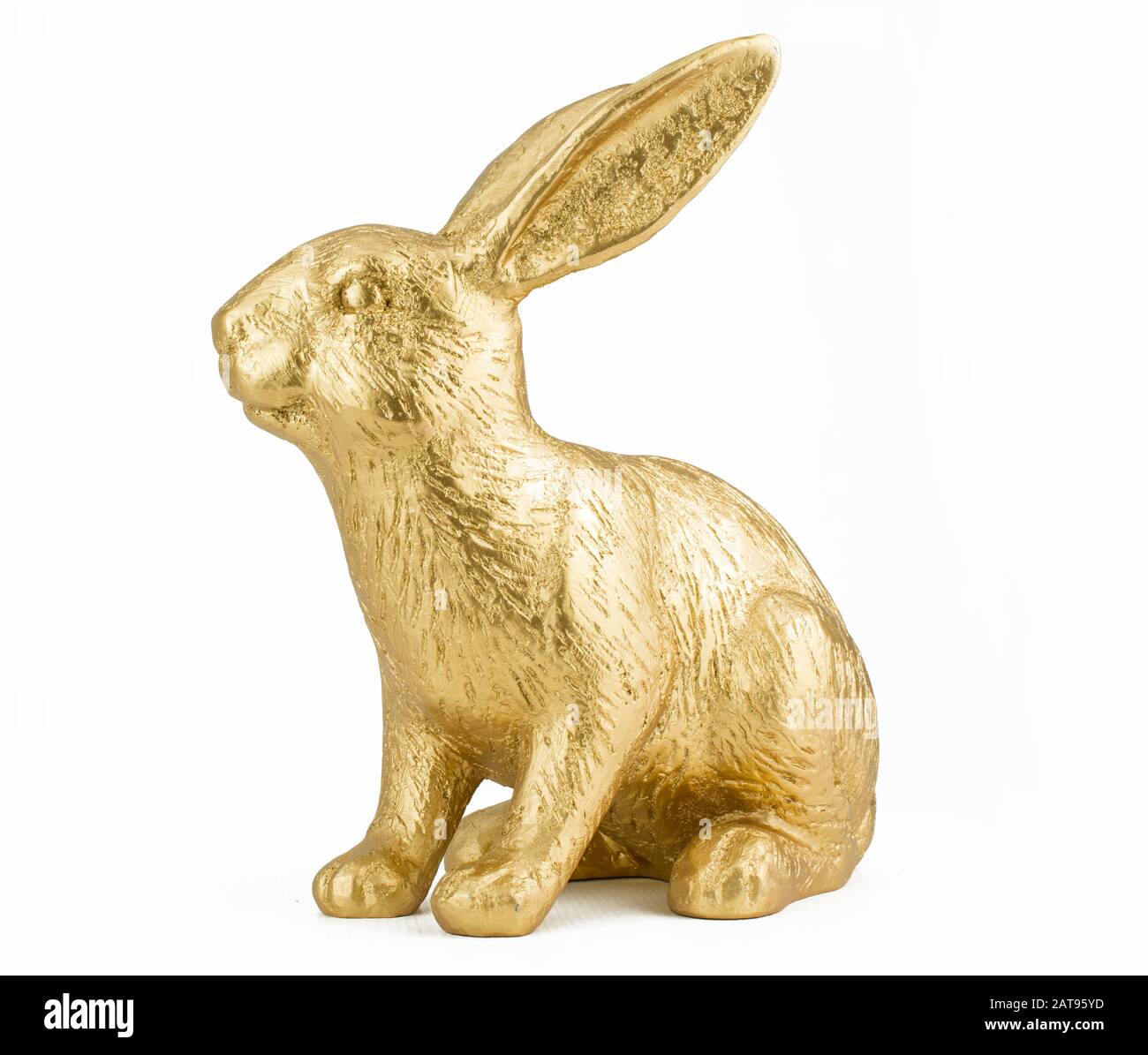 gold bunny rabbit on white background Stock Photo - Alamy
