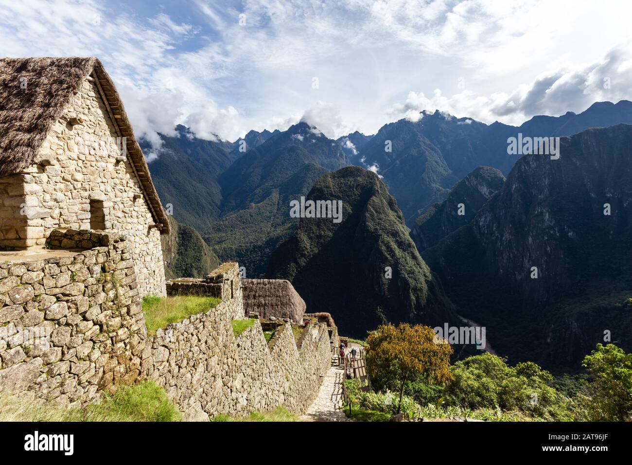 Houses and walls of the city of Machu Picchu, Peru. Clouds and ...