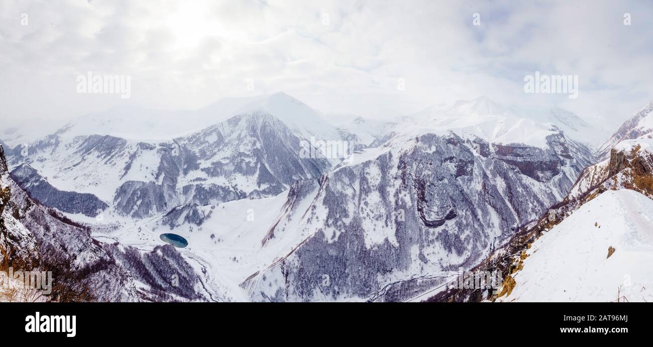 Georgia, Cross pass. panorama of mountains on a winter day. Sun, clouds ...
