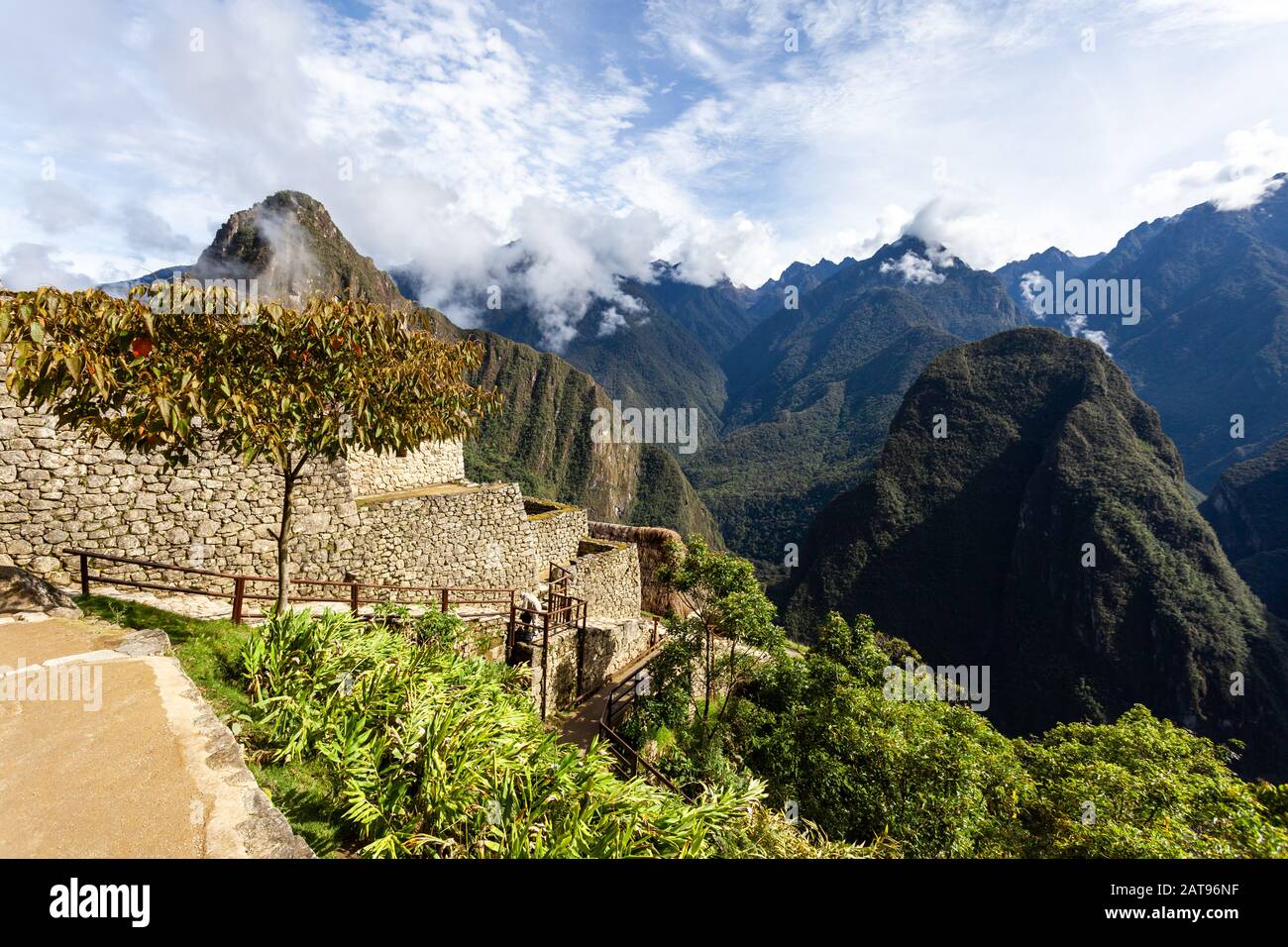 Houses and walls of the city of Machu Picchu, Peru. Clouds and ...