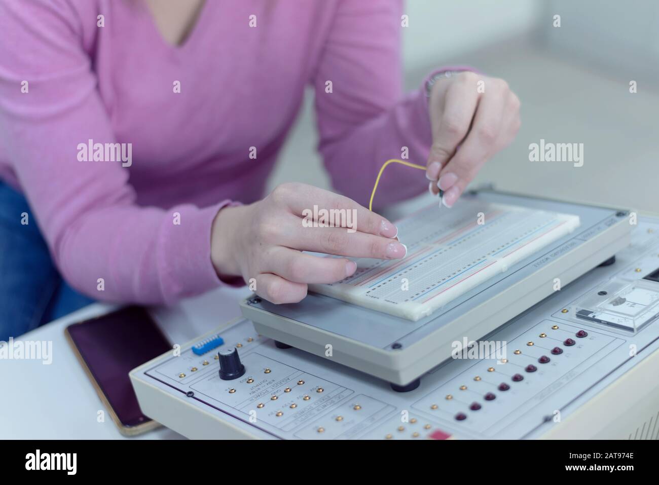 Engineering students working in the lab. Students are adjusting an ...