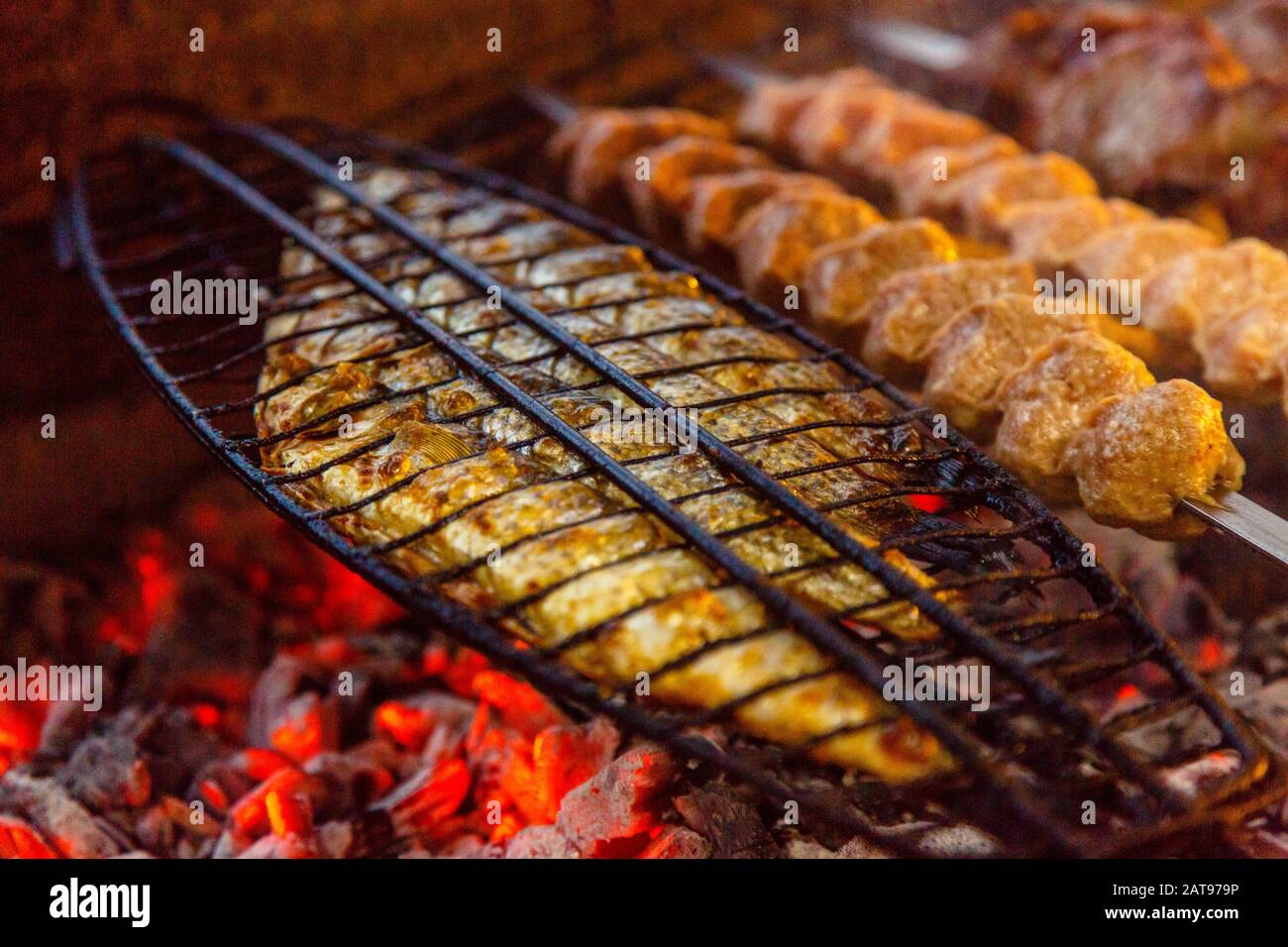 Fish is fried on the grill Stock Photo - Alamy