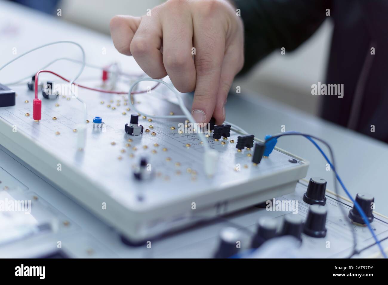 Engineering students working in the lab. Students are adjusting an ...