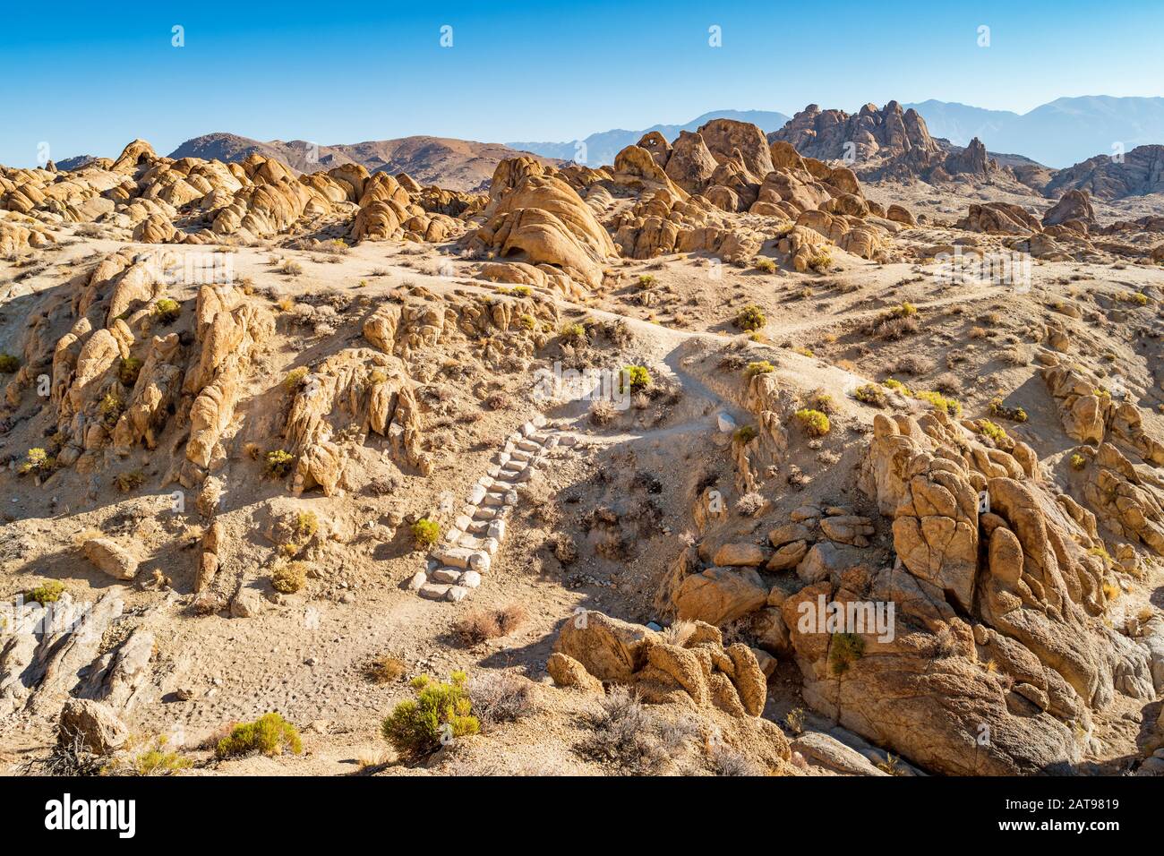 Path between the rock formations of the Alabama Hills in Sierra Nevada ...