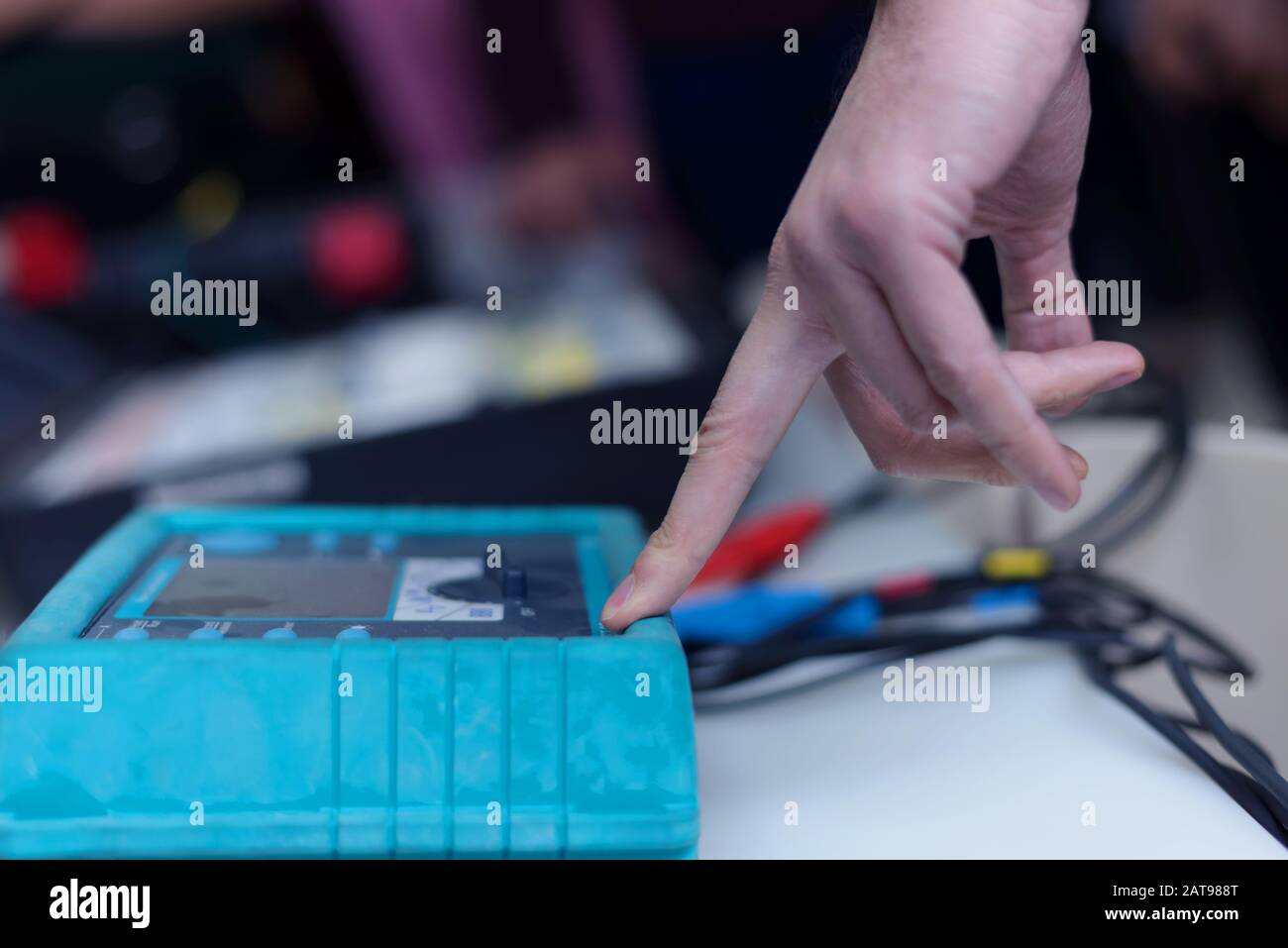 Engineering students working in the lab. Students are adjusting an ...